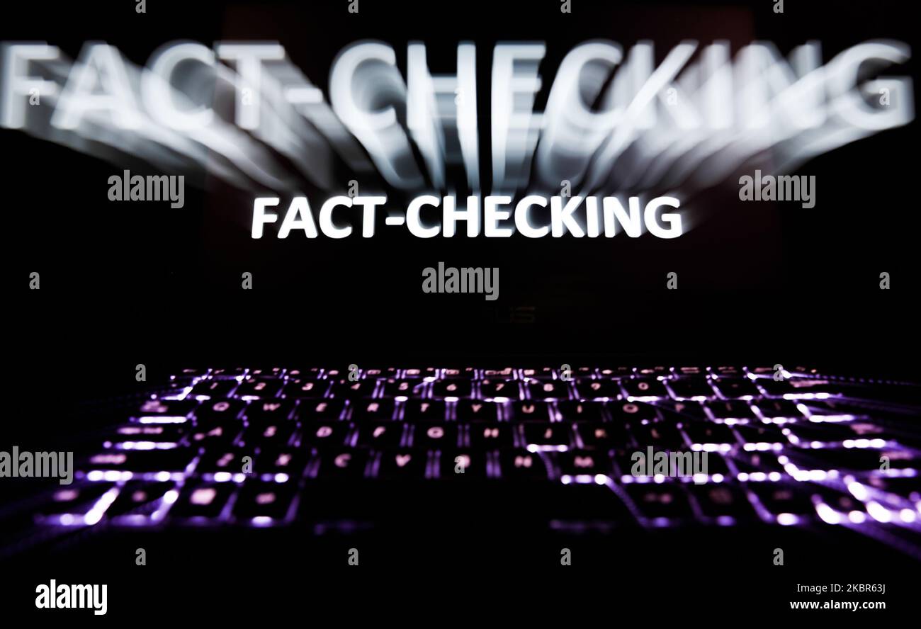 'Fact-checking' sign is seen displayed on a laptop screen in this long ...