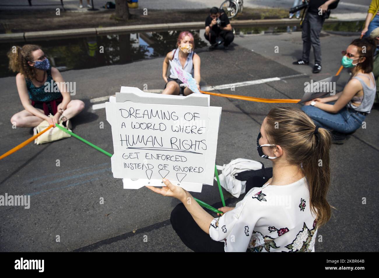 People attend a demontsration Unteilbar (undivisible) forming a human ...
