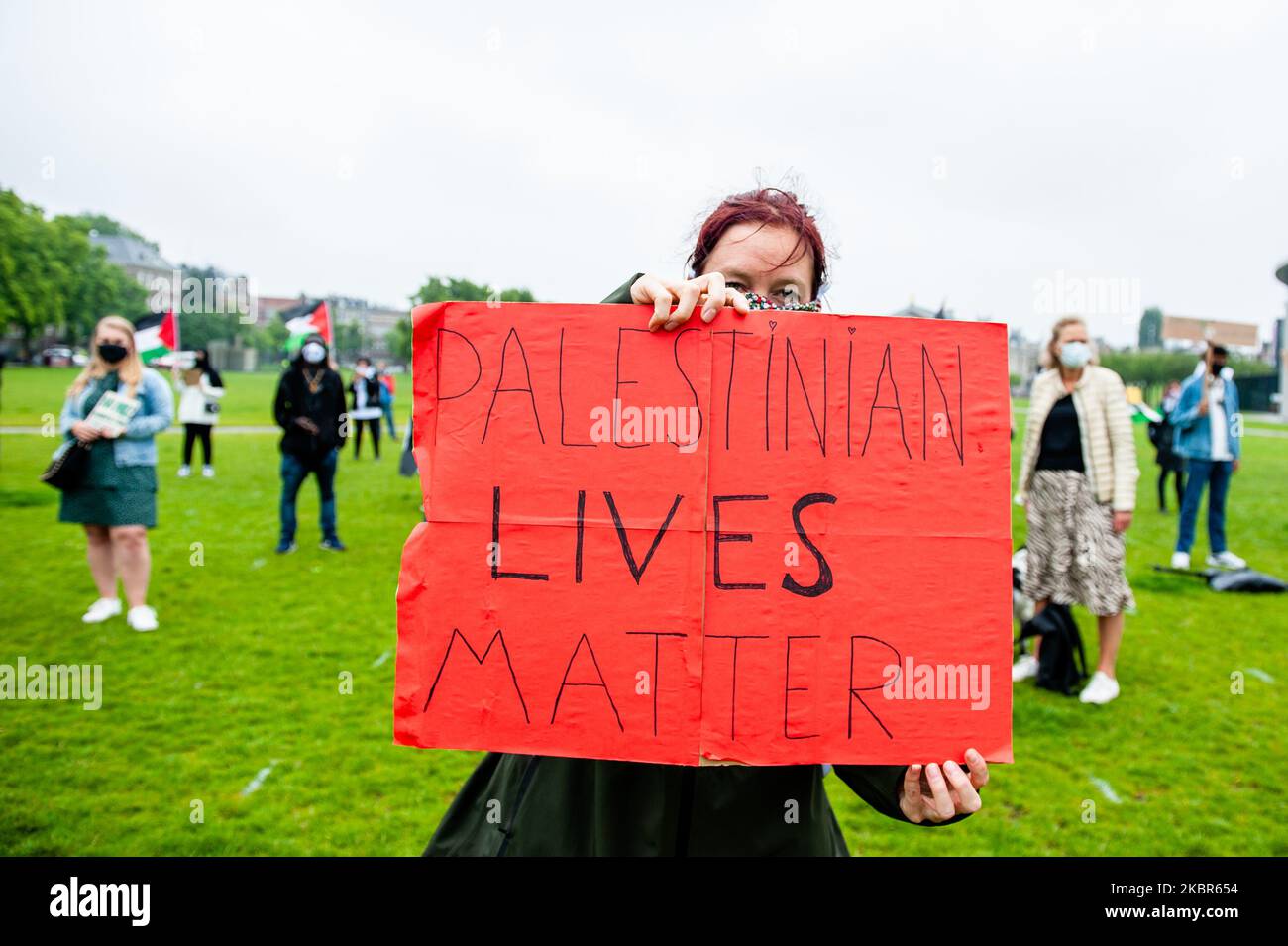 A woman is holding a pro Palestine placard, during the demonstration in ...