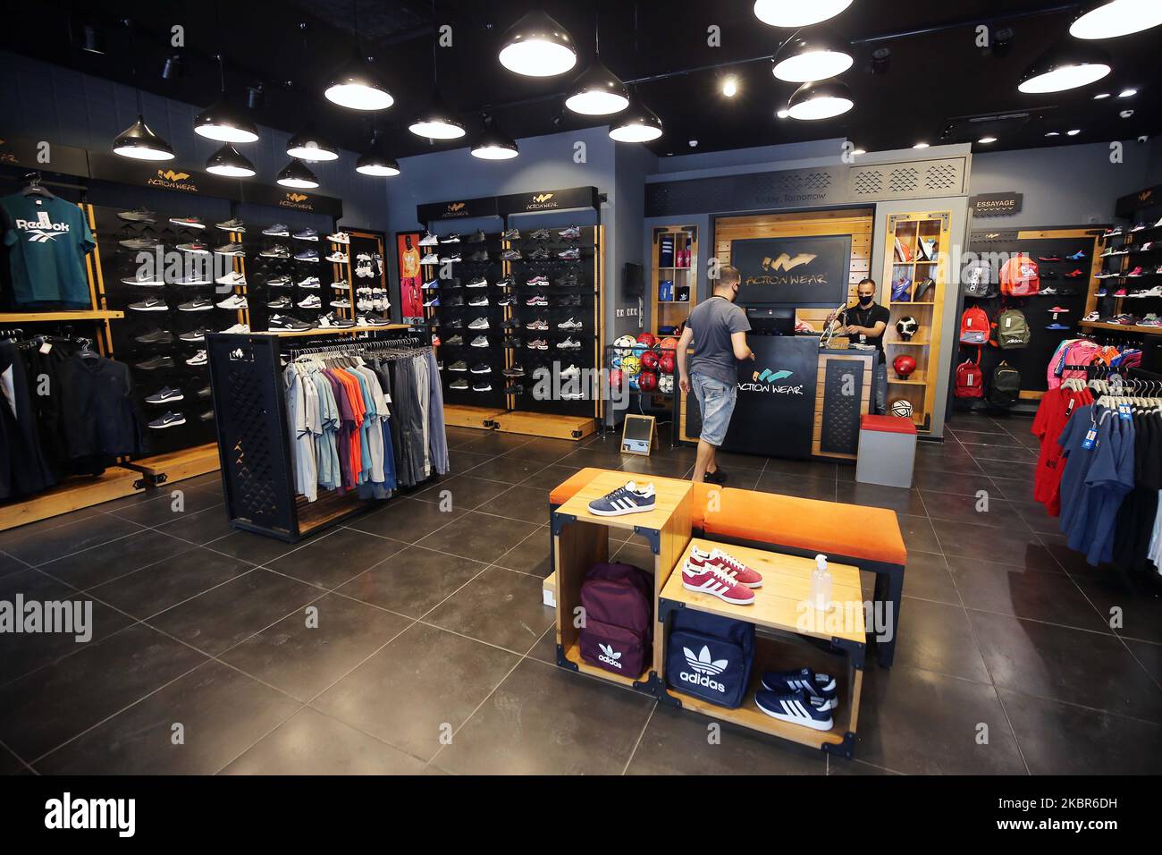 A shop assistant works in a shoe store in Algiers, Algeria, June 14, 2020. The Algerian ...