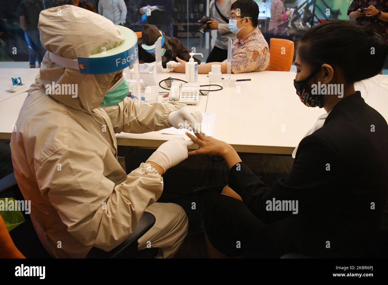 Workers take part in Rapid Test activities in Kuningan City, Jakarta ...