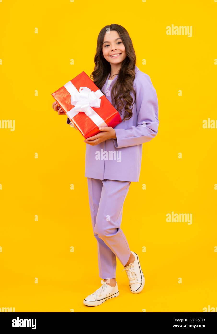 Teenager child with gift box, studio isolated background. Present for ...