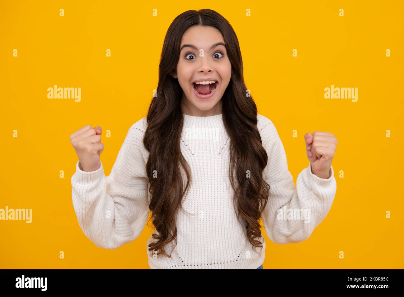 Excited expression, cheerful and glad. Teenager child doing winner ...