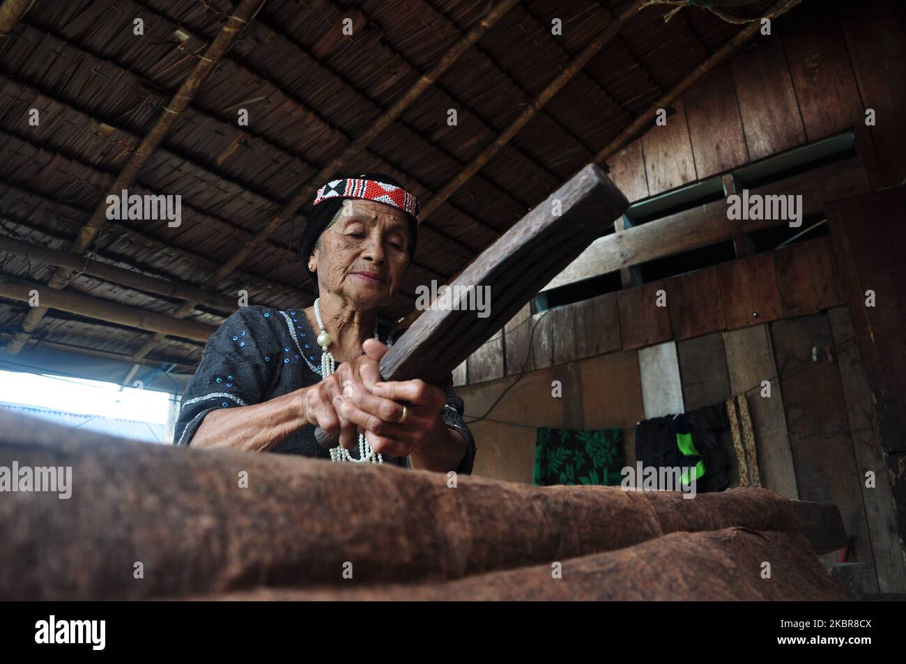 The process of beating bark that has been peeled aims to widen it into ...