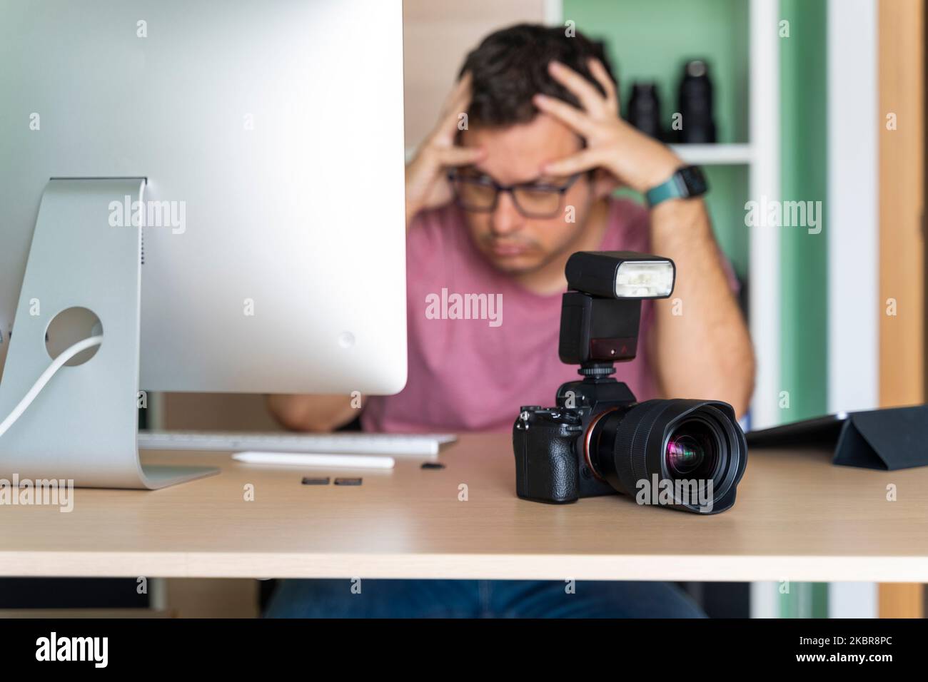 Man in his office worried about his photos on the computer Stock Photo ...