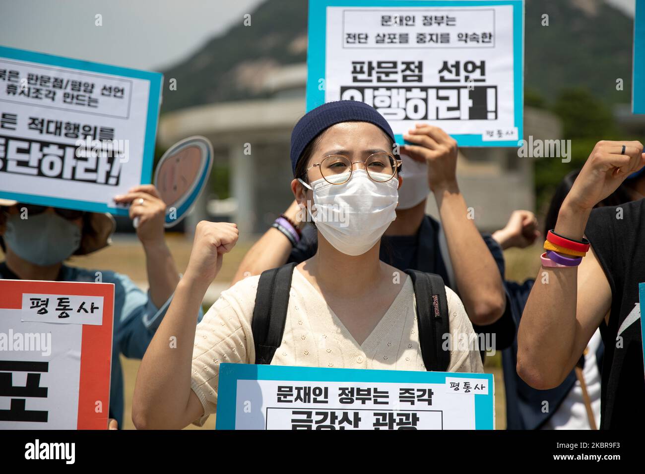 Members of Peace One Korea shout slogans during a demonstration against ...