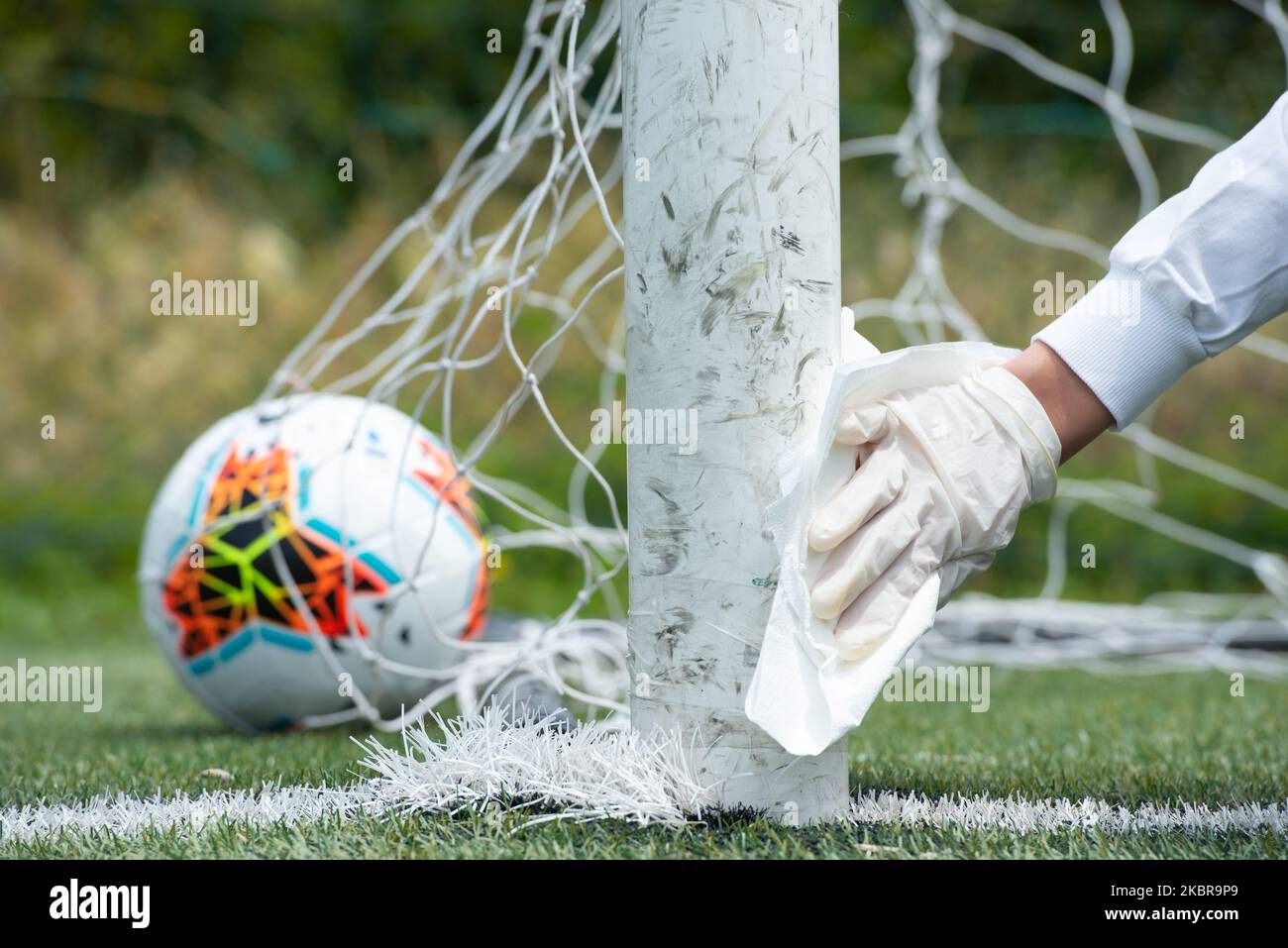 Covid 19 sanification of a football goal and an official Serie A ball ...
