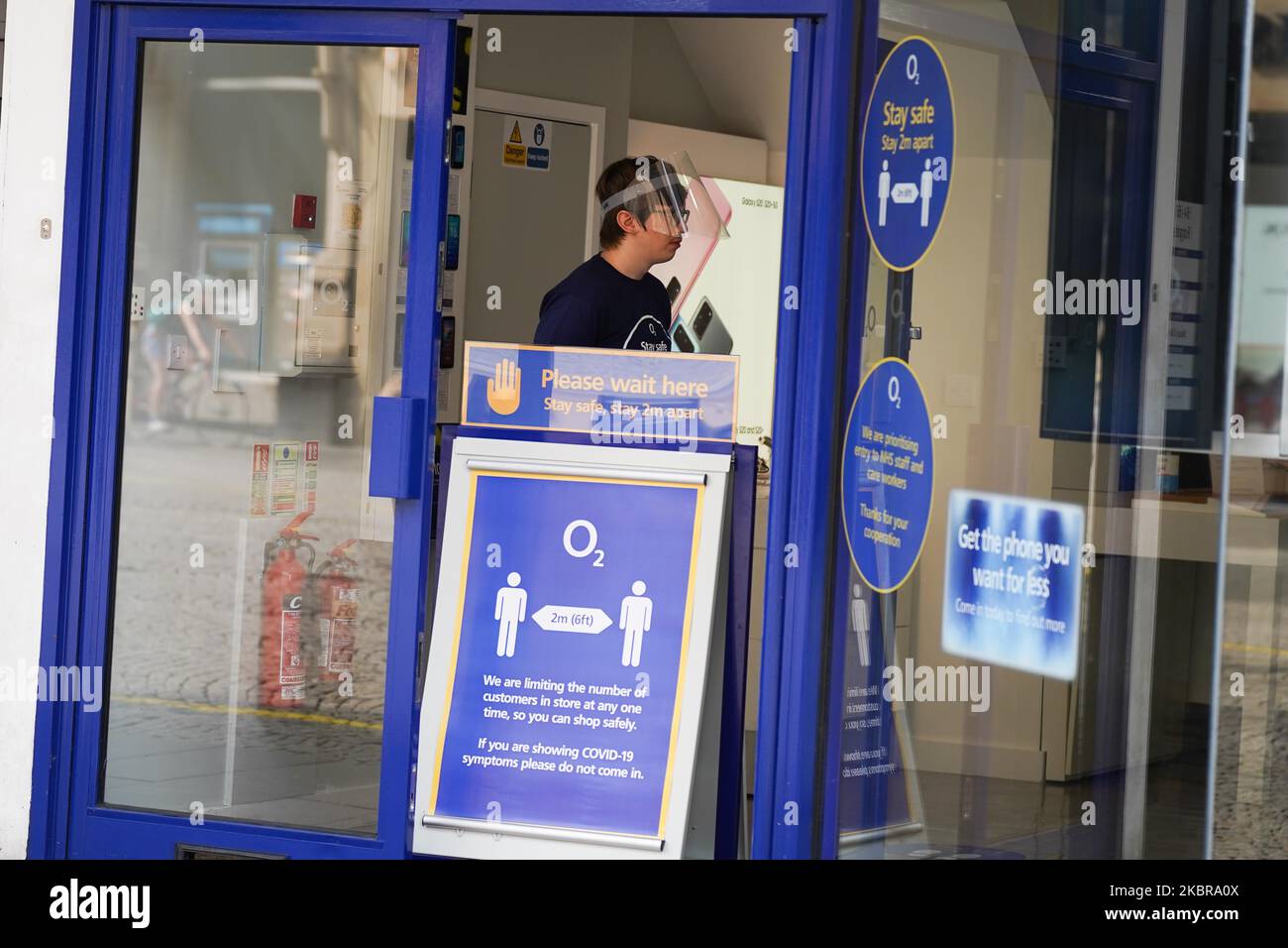 An employee wears a protective visor at ?2 in Sheffield, England on 17 ...