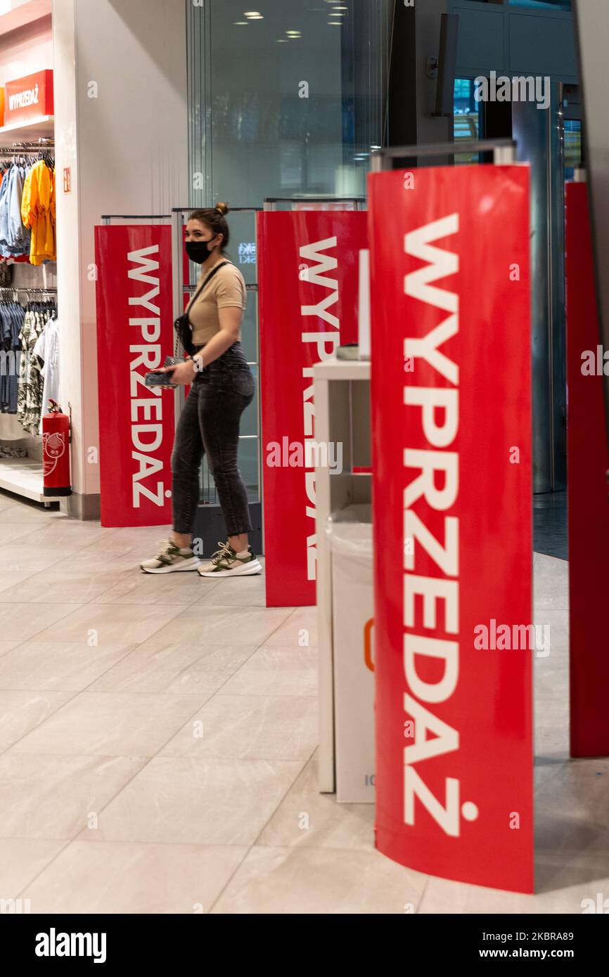 A Woman Is Seen Walking By A Sale Banners Zlote Tarasy Shopping Mall In