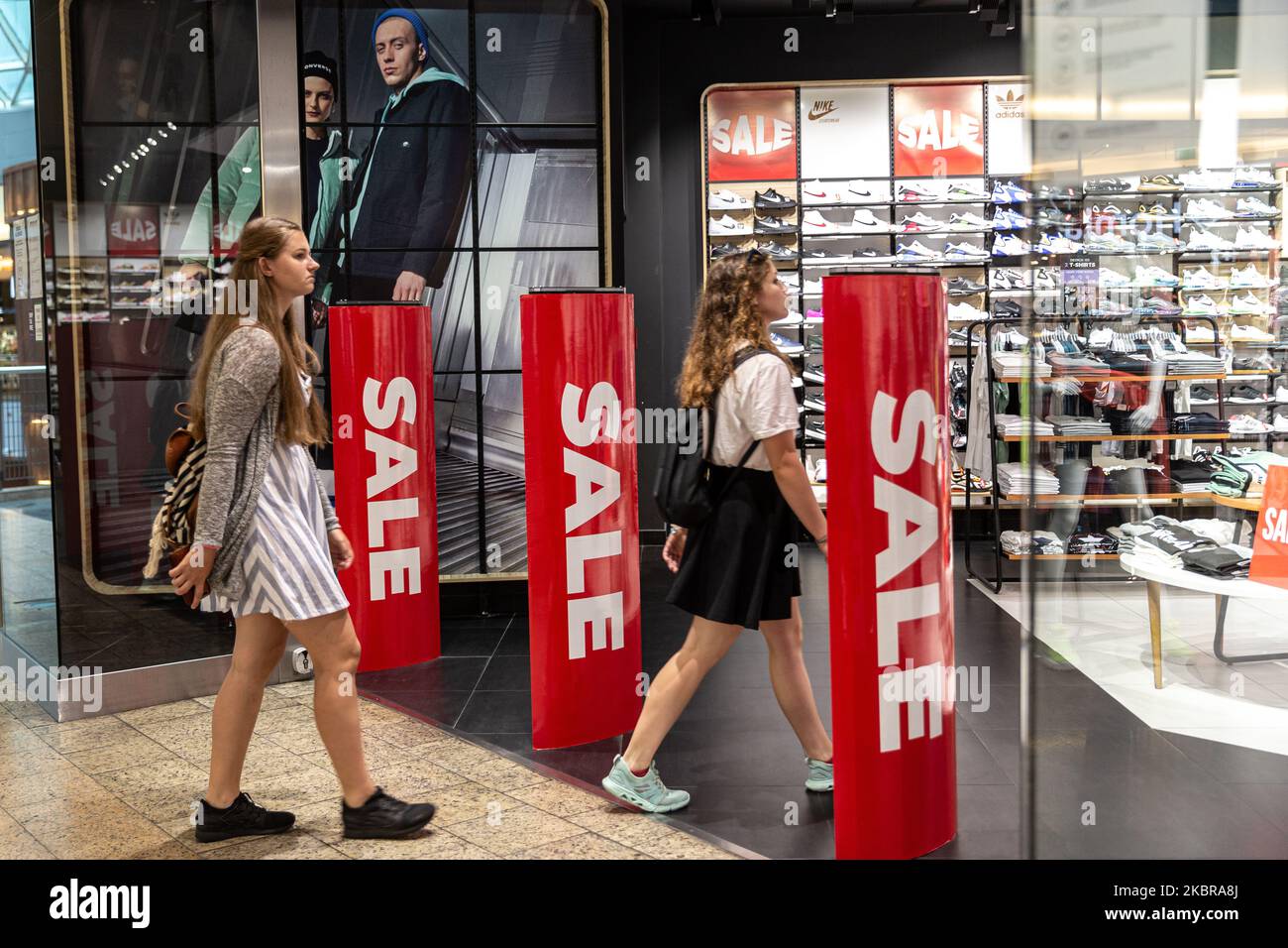 Women Are Seen Walking By A Sale Banners Zlote Tarasy Shopping Mall In