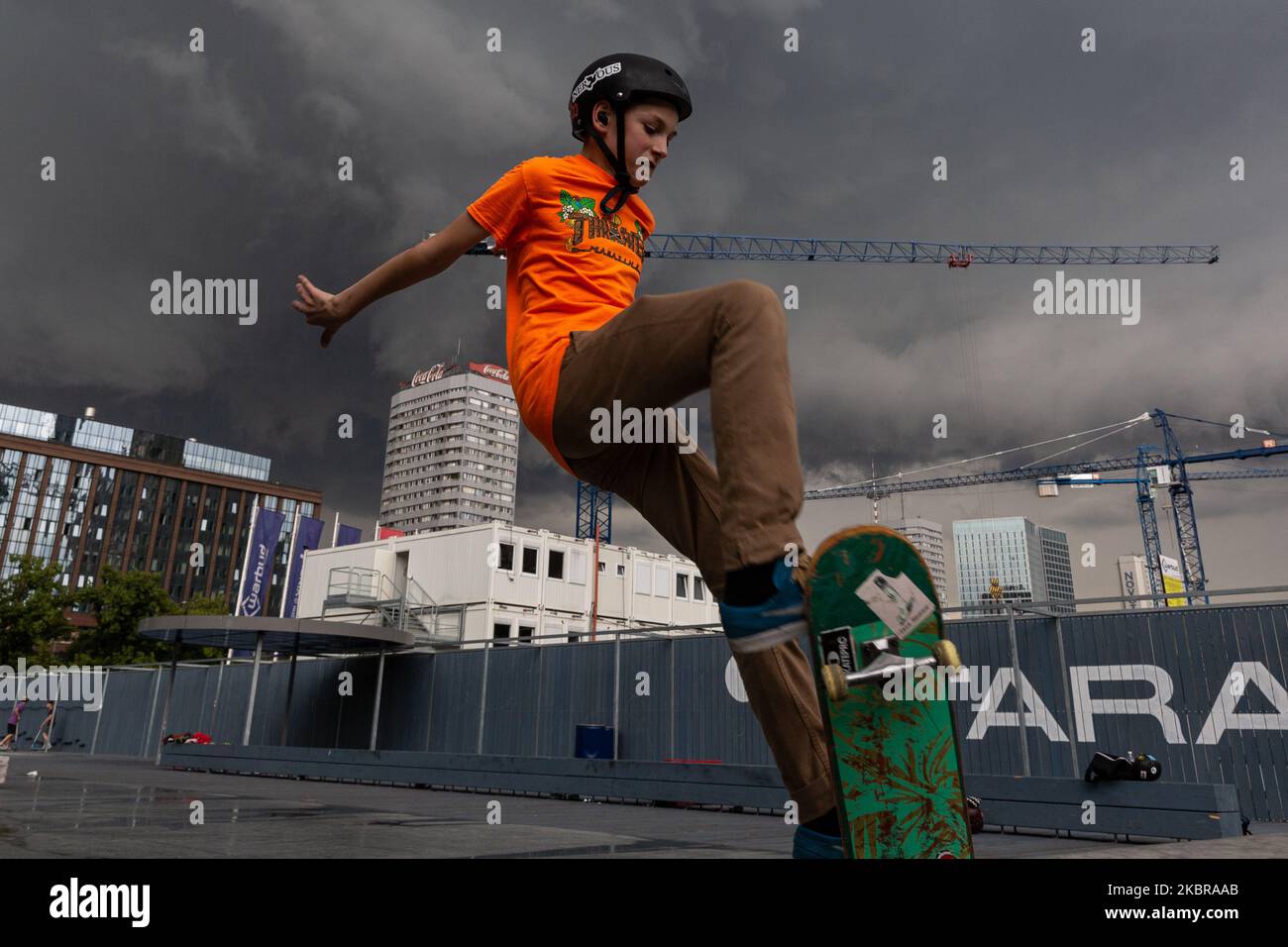 A teenage Andrzej is seen training his parkour skills as several heavy ...