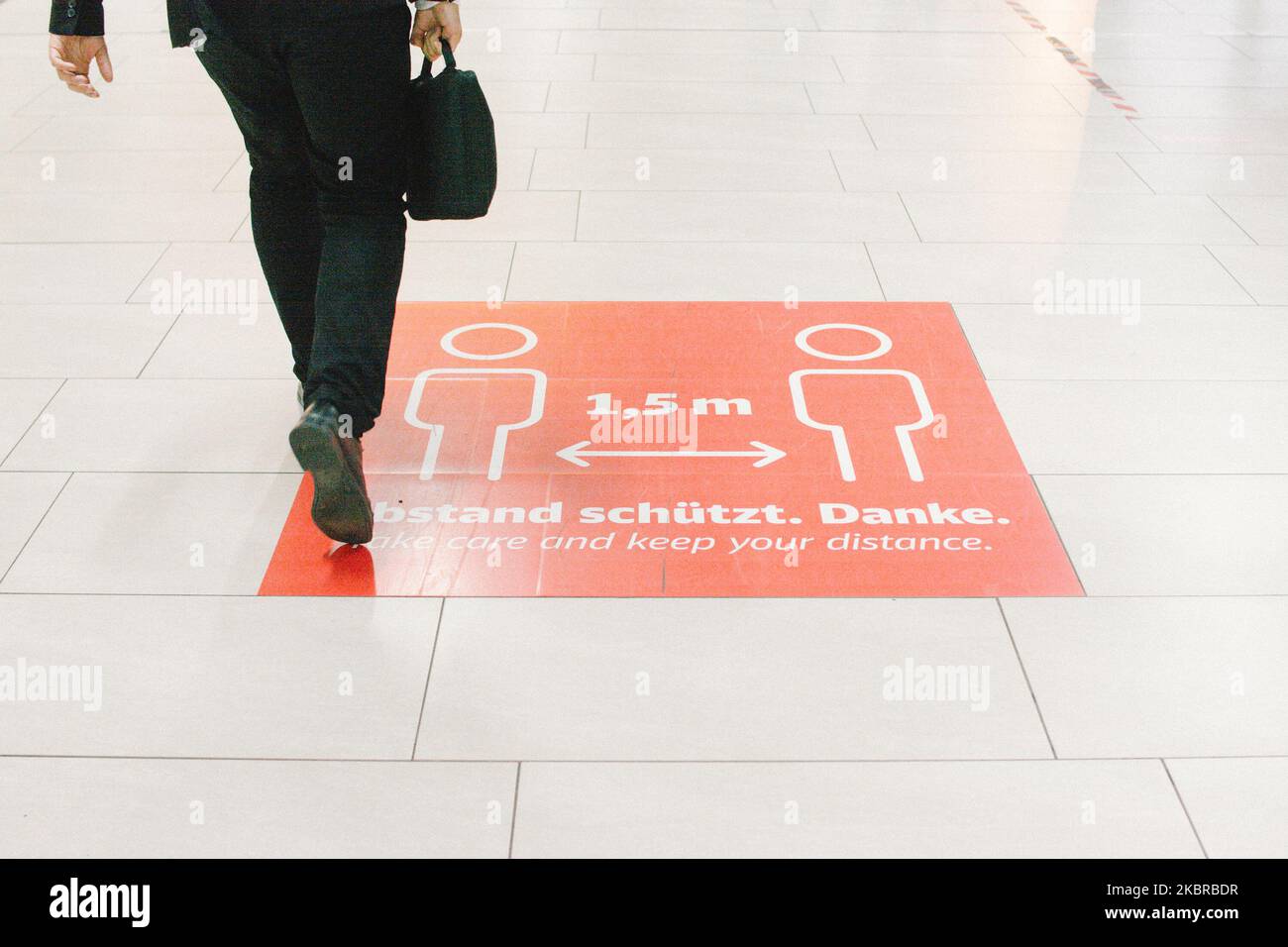 1.5 meter social distance sign taped on the pavement in the center ...