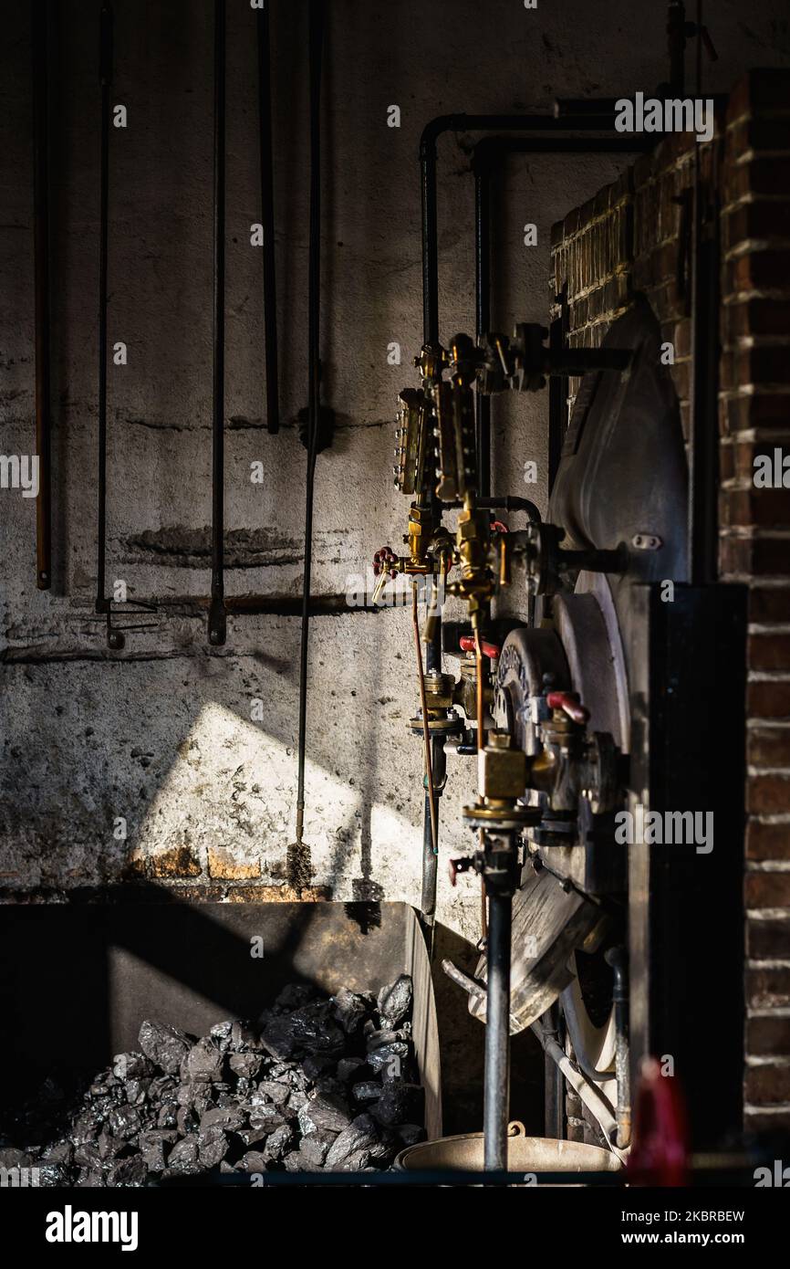 Vintage steam engine with boiler, old pipes and control valves for ...