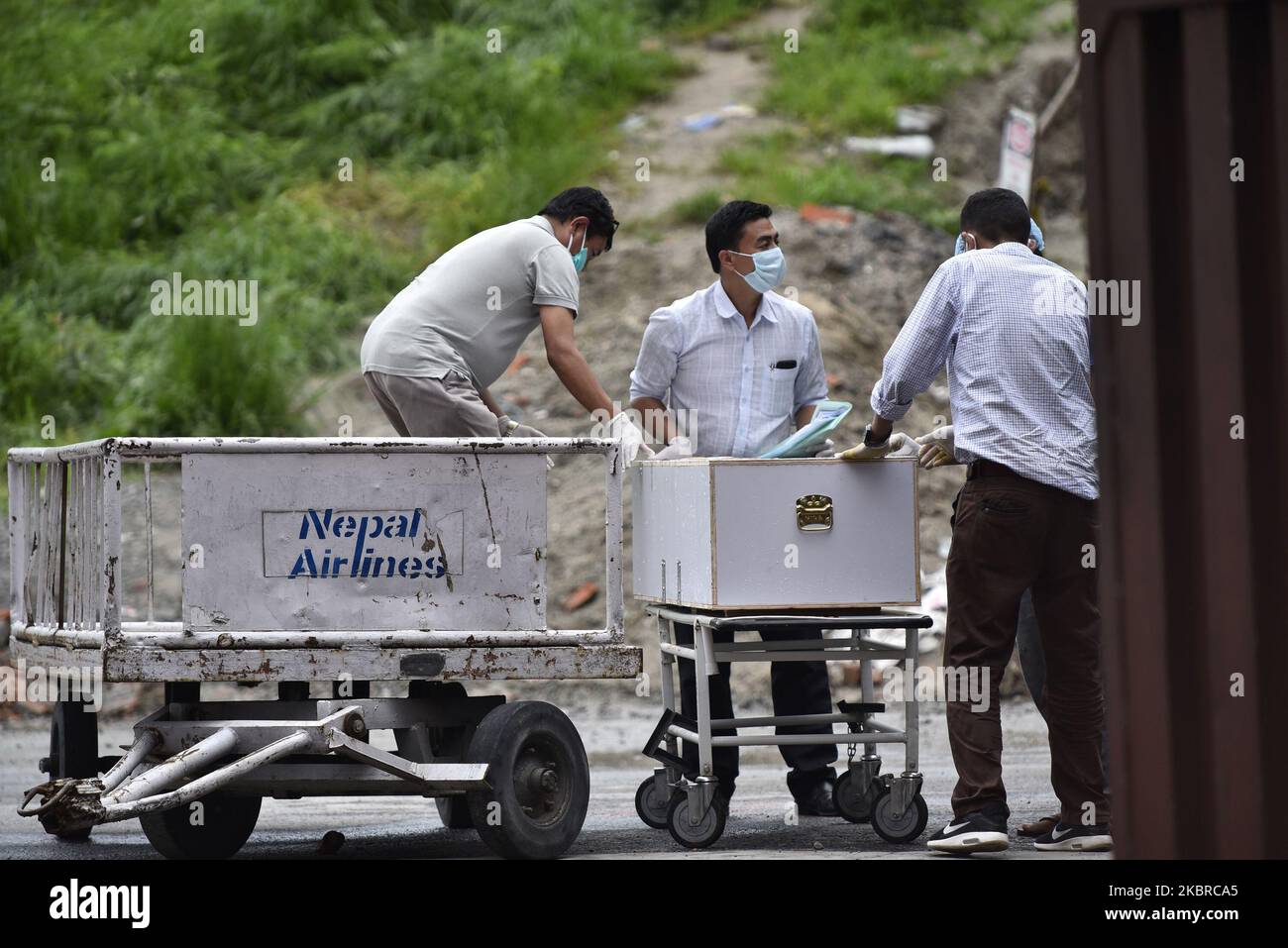 Family members and relatives carrying dead bodies of a Nepalese migrant ...