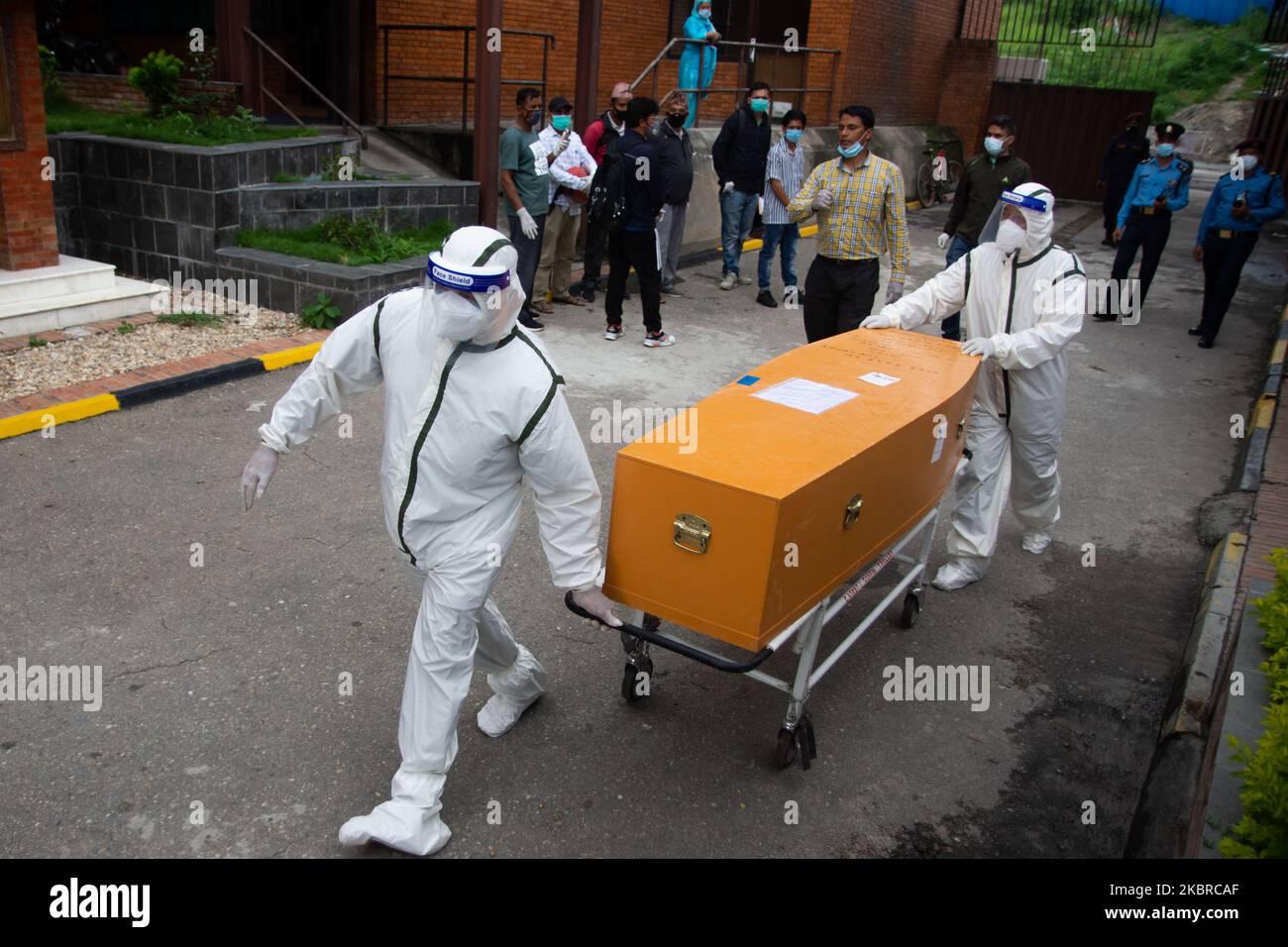 People load a coffin carrying body of Nepalese migrant worker who died ...