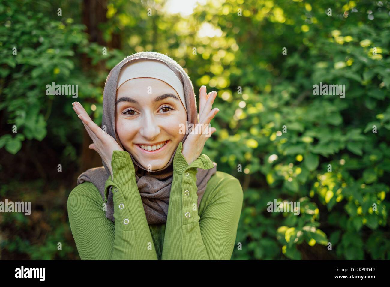 Beautiful joyful teen high school girl wearing colorful muslim clothing ...