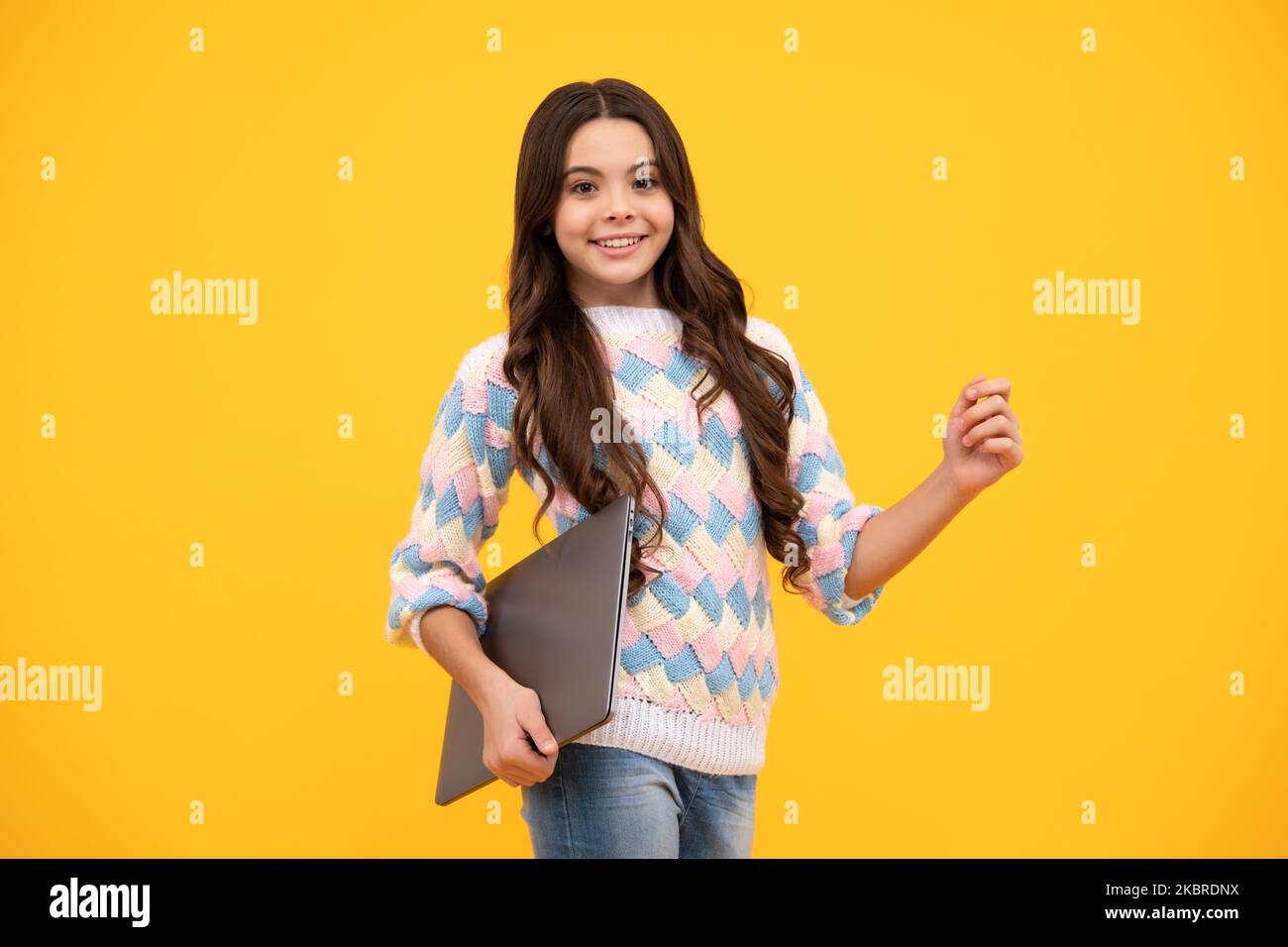 Young girl student hold computer. Funny pupil with laptop isolated on ...
