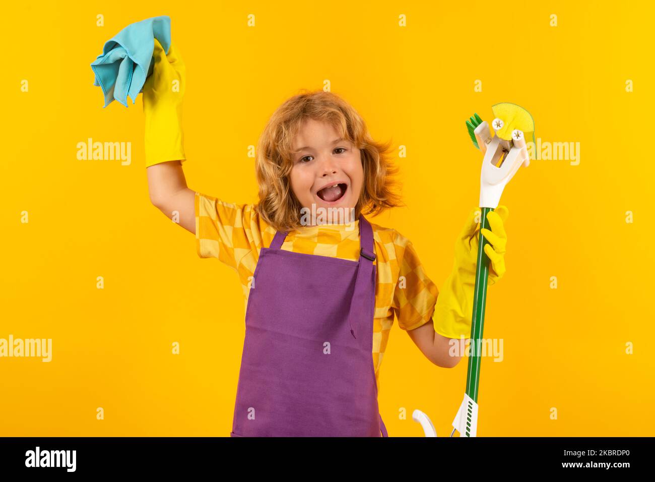 Child helping to clean. Child doing housework having fun. Studio ...