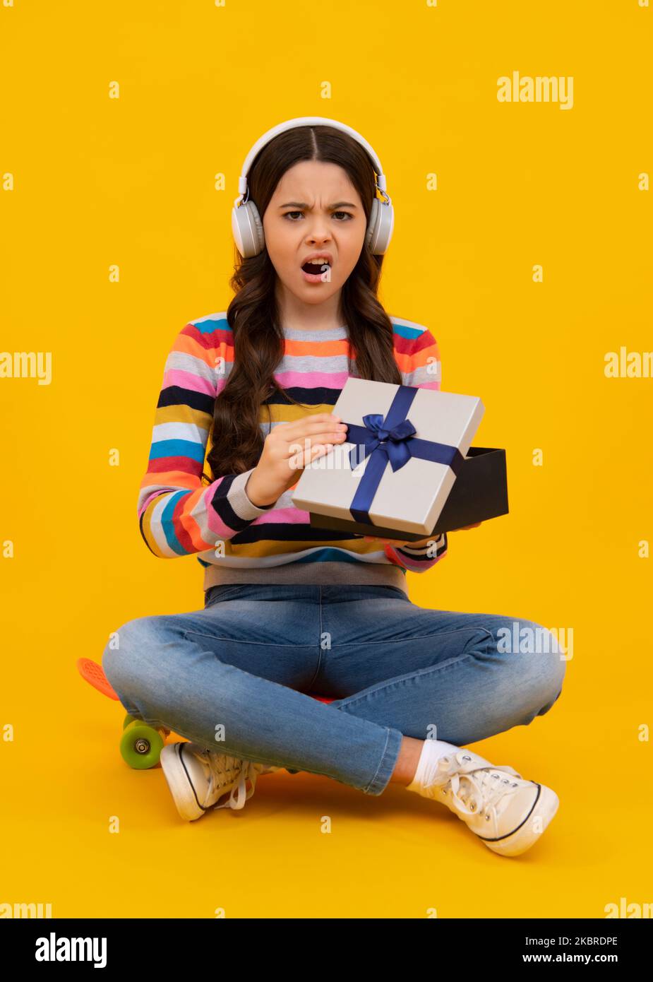 Unhappy sad teenager girl. Teenager kid with present box. Teen girl ...