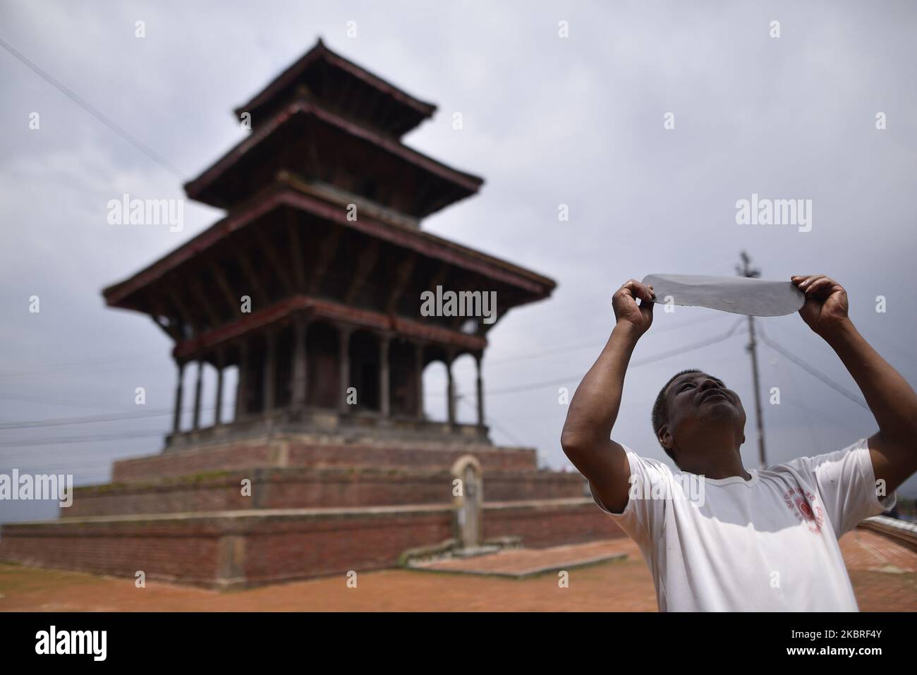 Nepalese people observing Partial Solar Eclipse using solar filter from ...