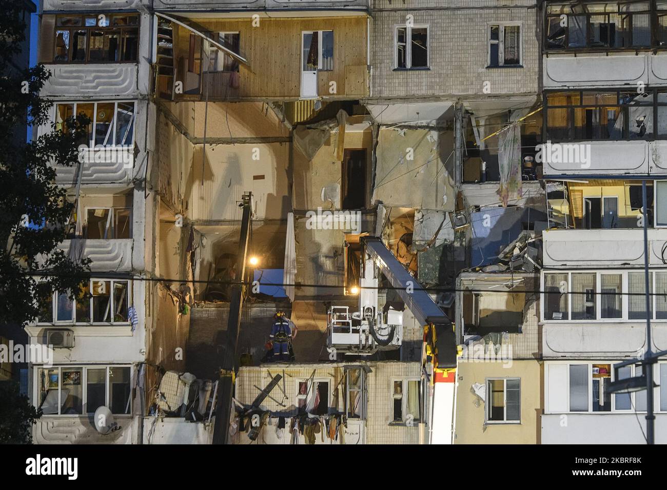 Ukrainian rescue workers clean debris after a gas explosion in nine ...