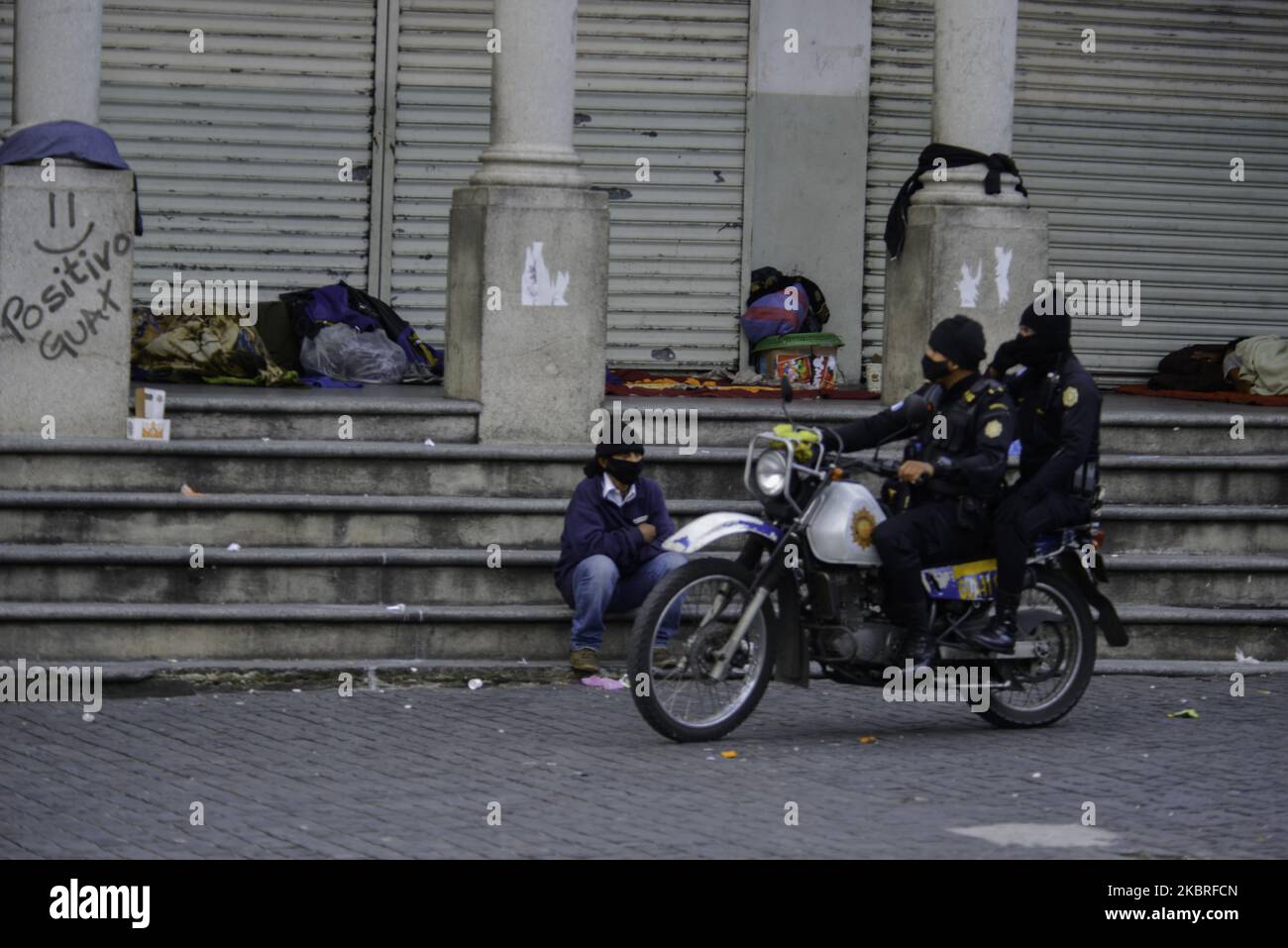 The Guatemalan National Police patrol the central park on Sunday 21 ...