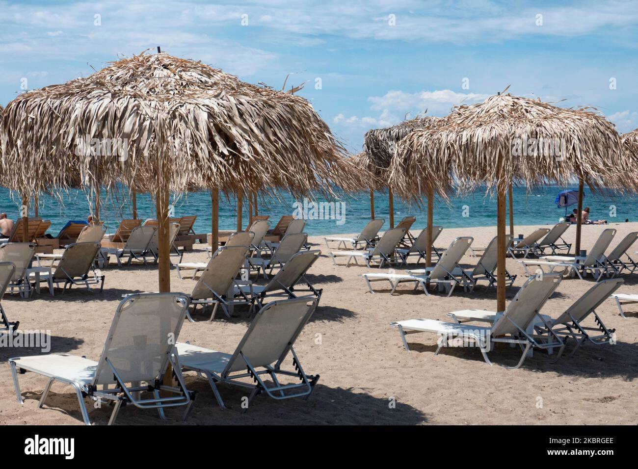 Sandy beach during a sunny day and Beach Bar at Nea Irakleia ...