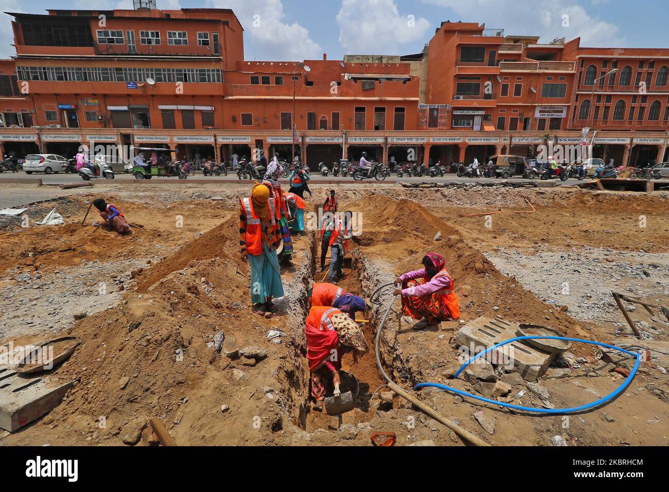 Labourers work under the Smart City Project on Chandpole Bazar road, at ...