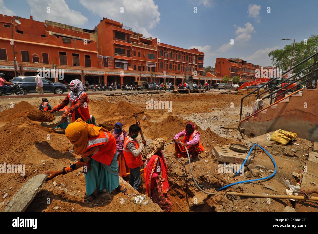 Labourers work under the Smart City Project on Chandpole Bazar road, at ...