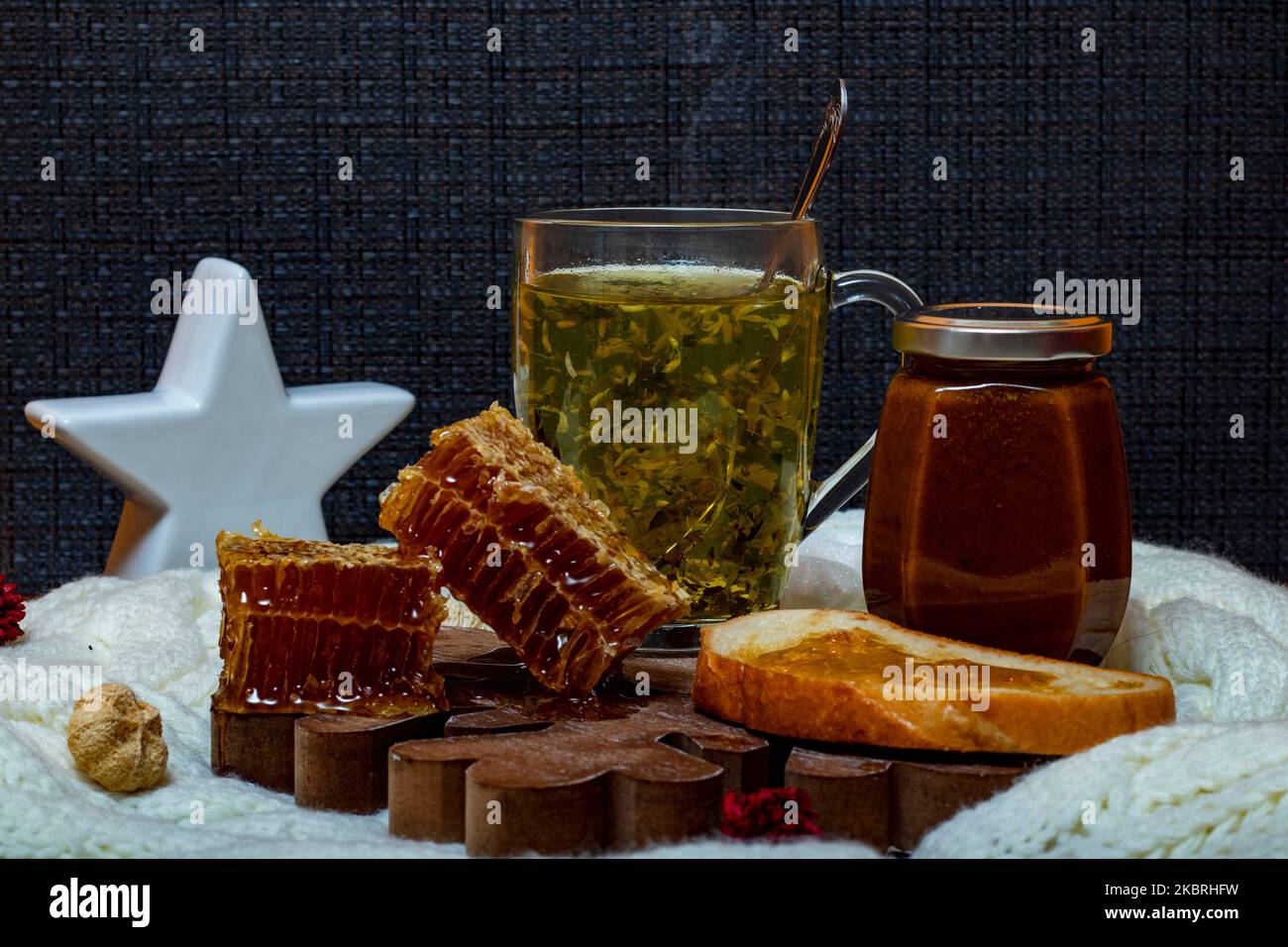 Honey in a jar with honeycomb and bitter green tea Stock Photo - Alamy