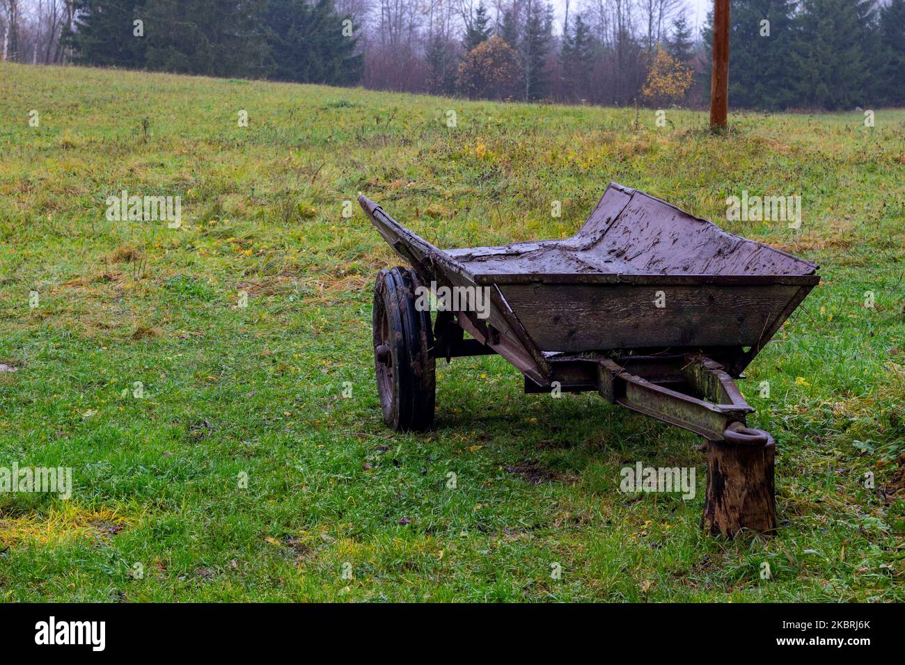 Wooden trailer in autumn with mud Stock Photo - Alamy