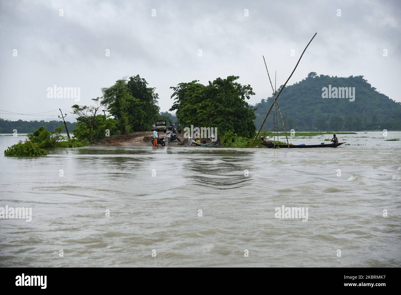 Water overflowing on a road by floodwater following heavy rainfall, at ...