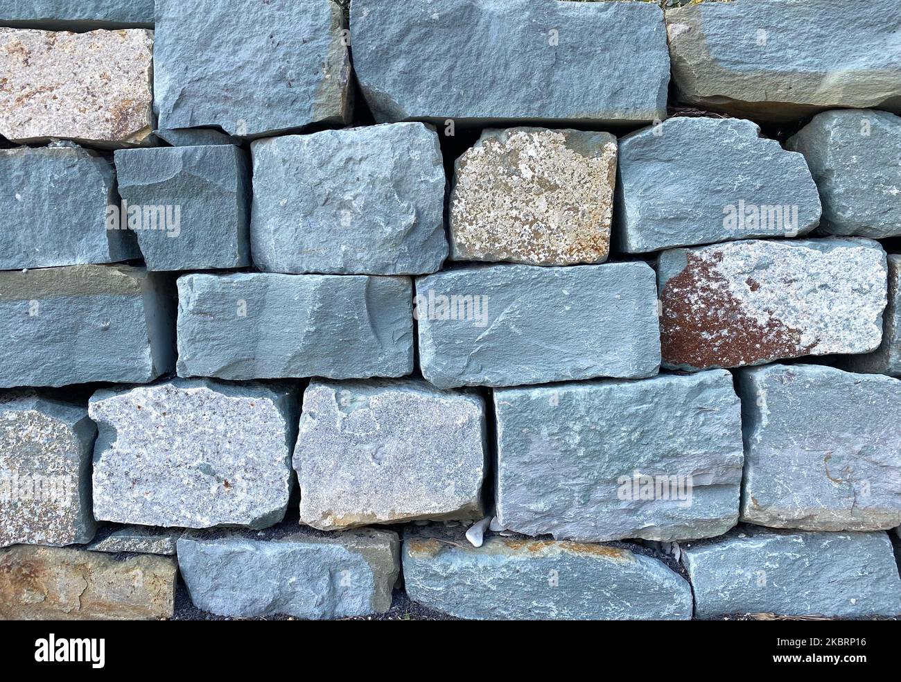 Stone wall from rough stones. background Stock Photo - Alamy