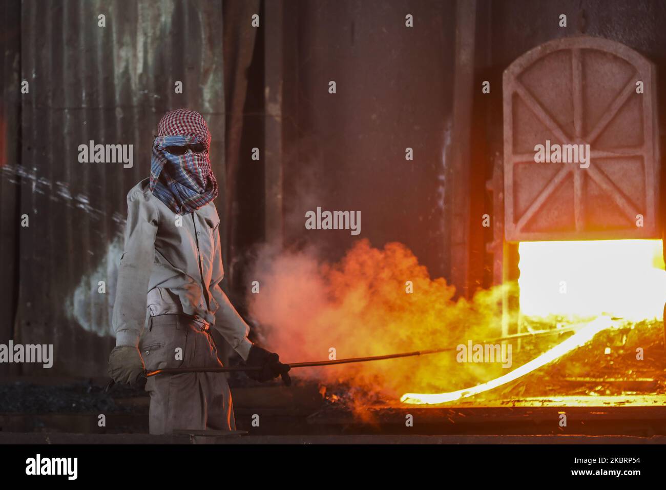 Bangladeshi still re-rolling mill worker pose for a portrait in the ...
