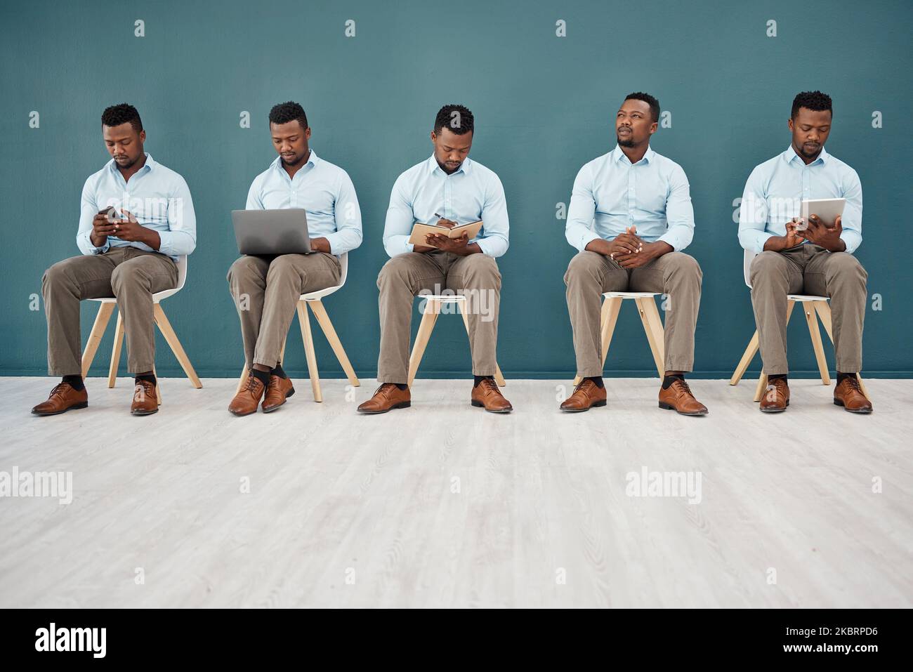 Interview, hiring and waiting with a black man in business sitting in ...