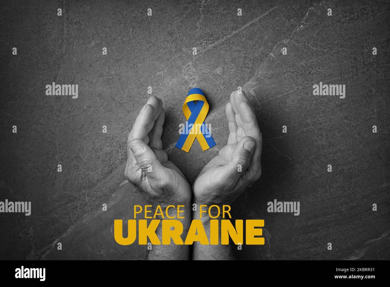 blue yellow ribbon with male arms on marble Stock Photo - Alamy