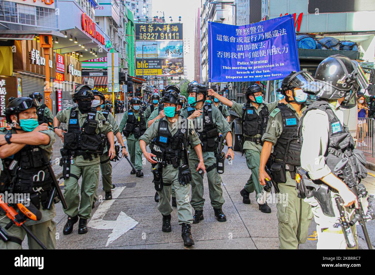Police raise the blue flag in attempts to disperse gathering crowds ...