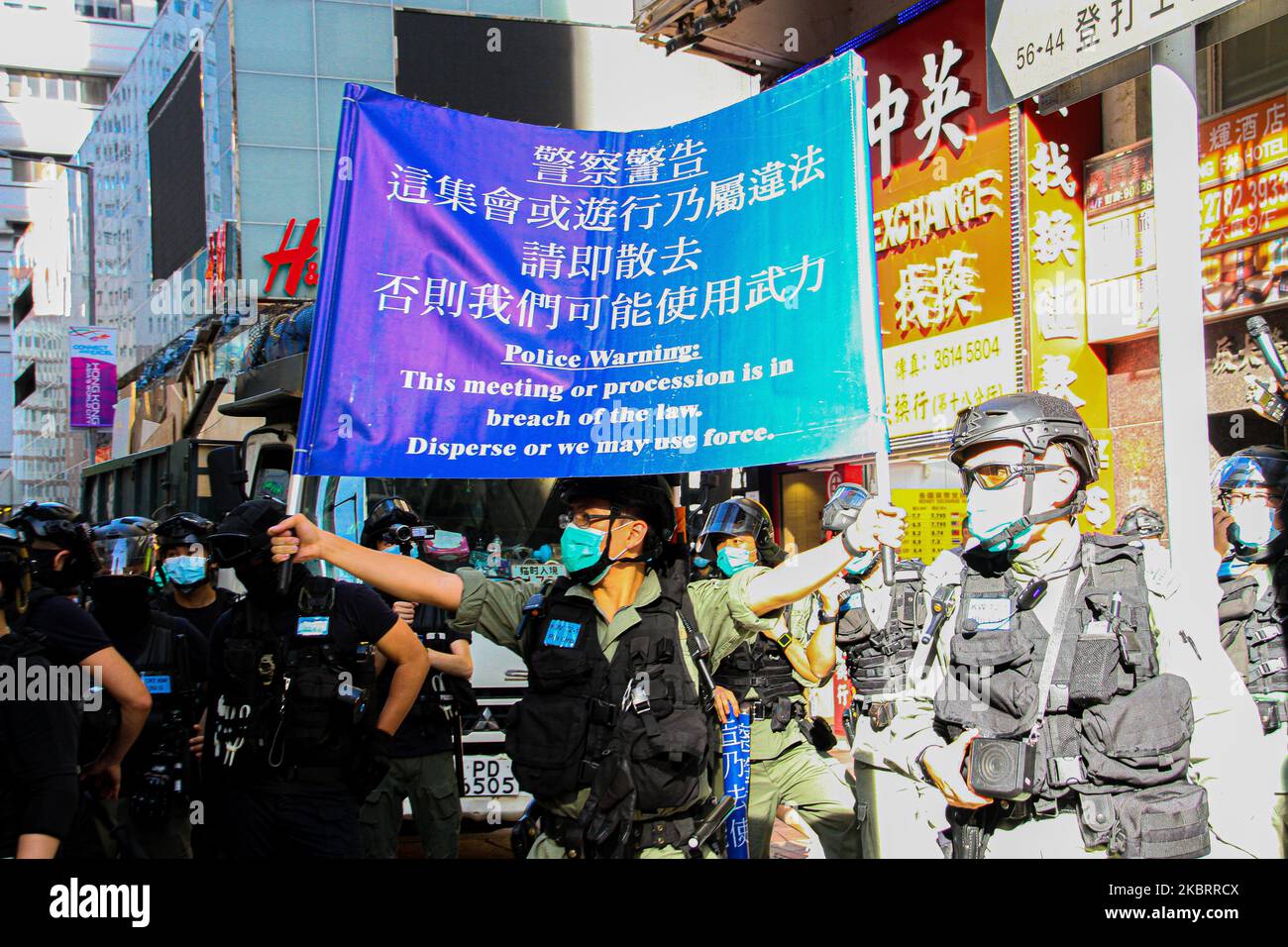 Police raise the blue flag in attempts to disperse gathering crowds ...