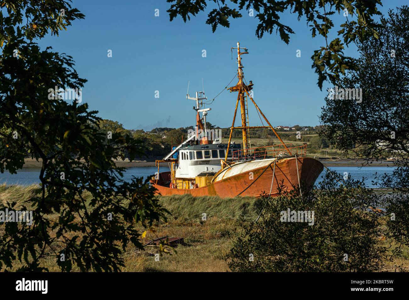 A former trawler now being used as a home, moored on River Torrington ...