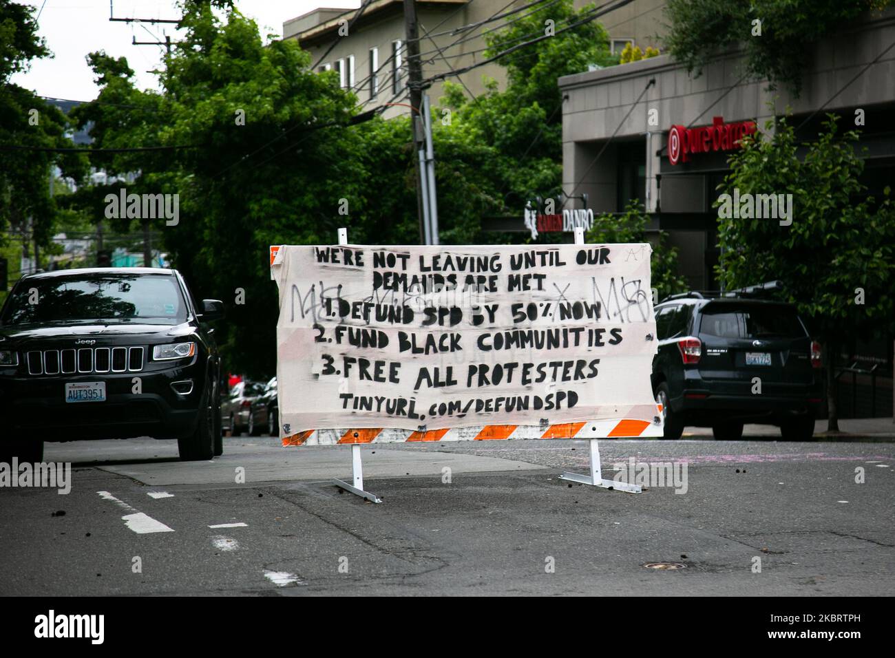Signs sit outside in the area known as the Capitol Hill Organized ...