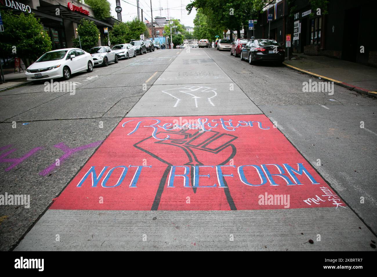 Signs sit outside in the area known as the Capitol Hill Organized ...