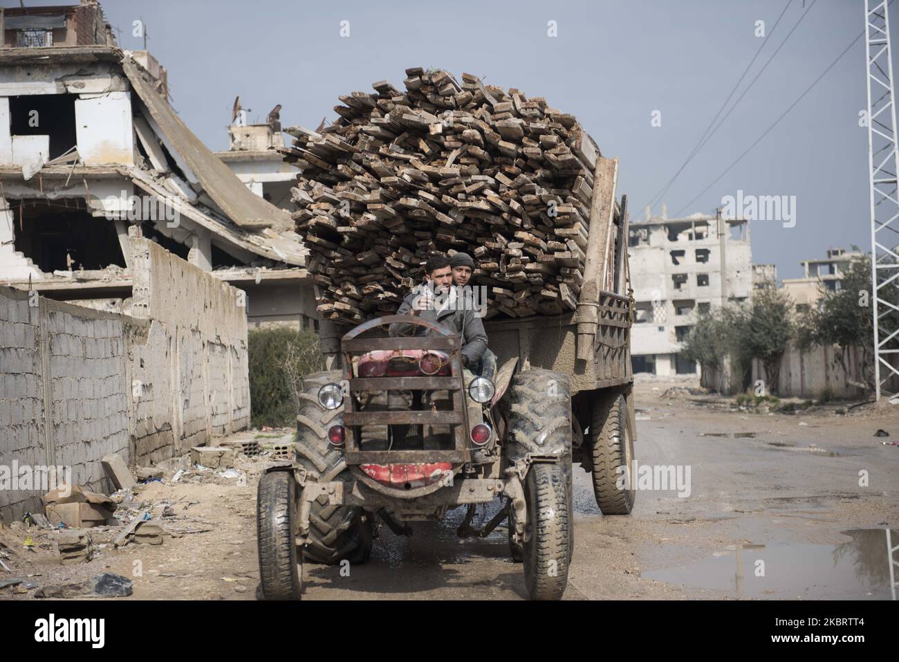 tow of men in the main street of Al -Mliha rural of Damascus transfer ...