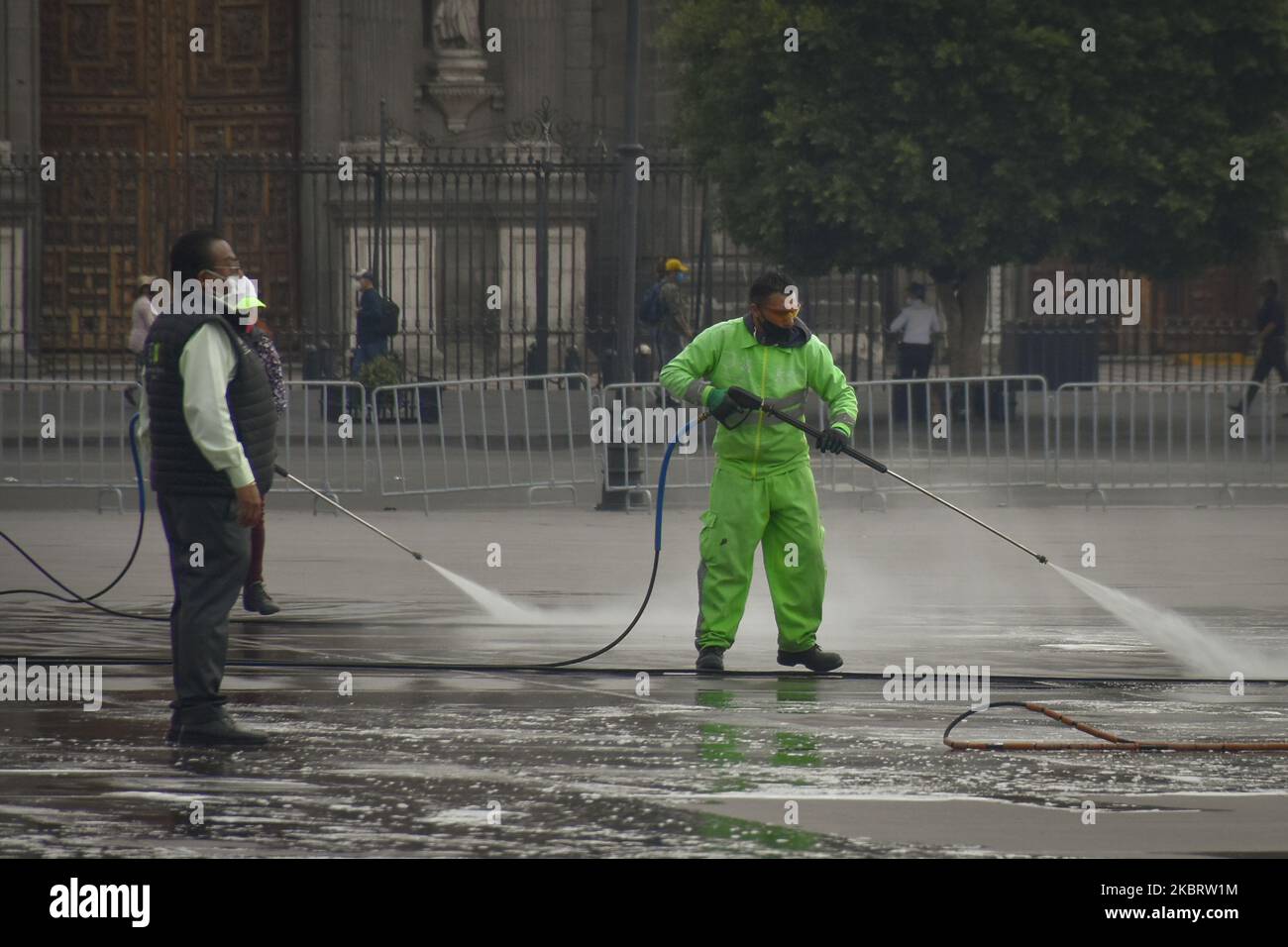 Workers of Mexico City Government clean The Plaza of Zocalo during ...