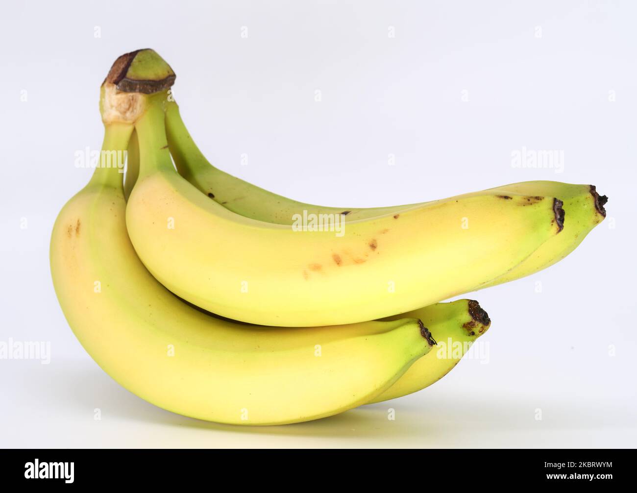 Natural banana cluster single against a white background Stock Photo ...