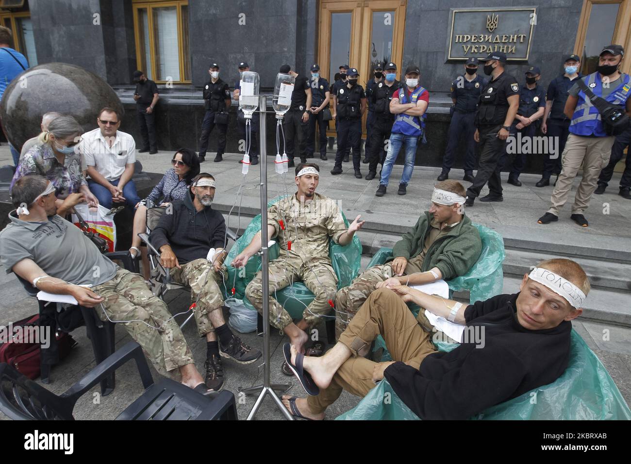 Supporters and friends of voluntary fighter Vitaliy Oleshko receive a ...