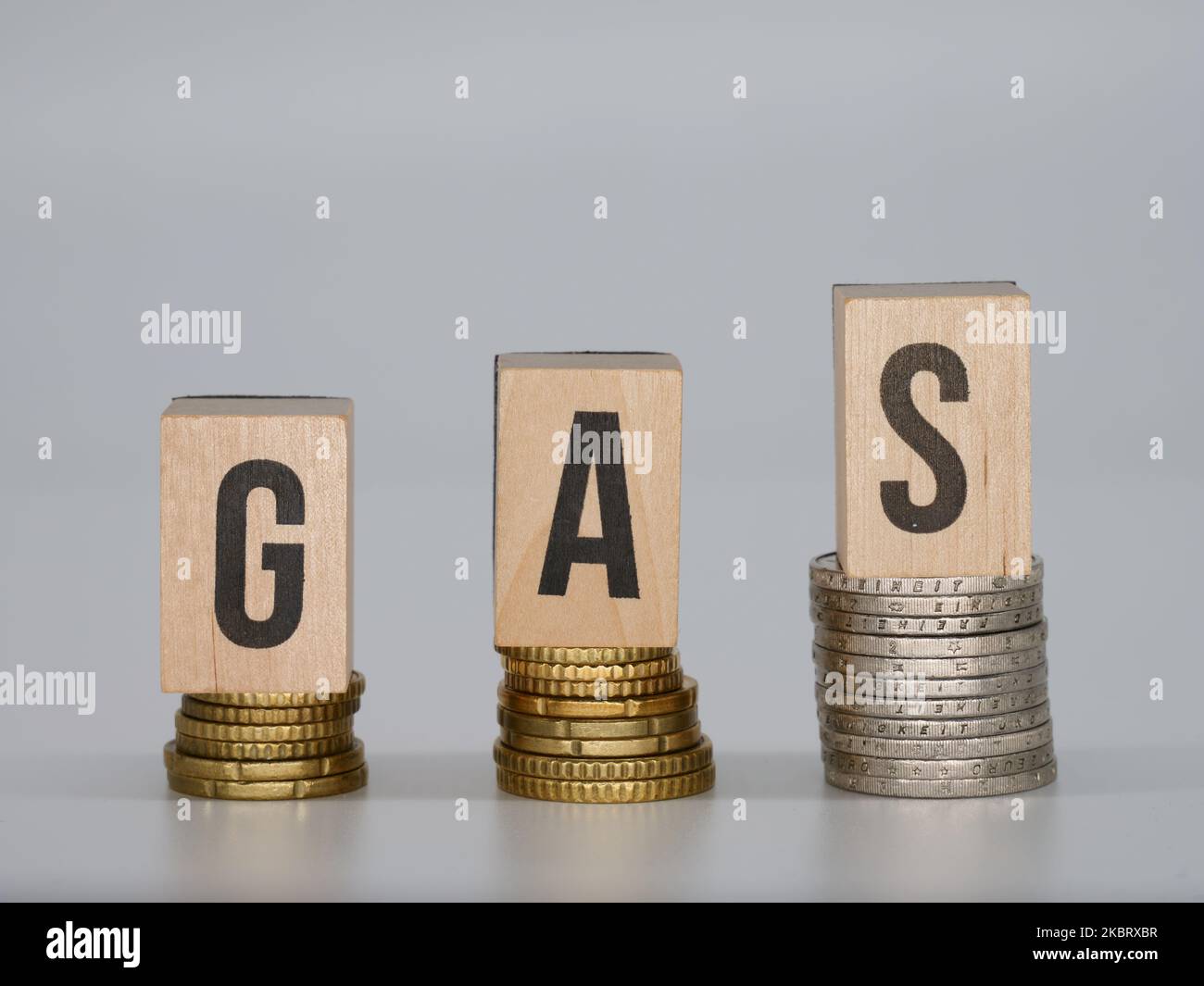 Close-up of letters with the word gas and euro coins. Focus on gas ...