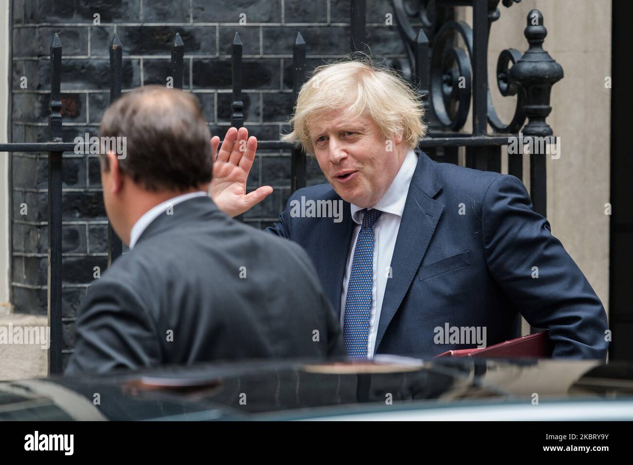 British Prime Minister Boris Johnson leaves 10 Downing Street for PMQs ...