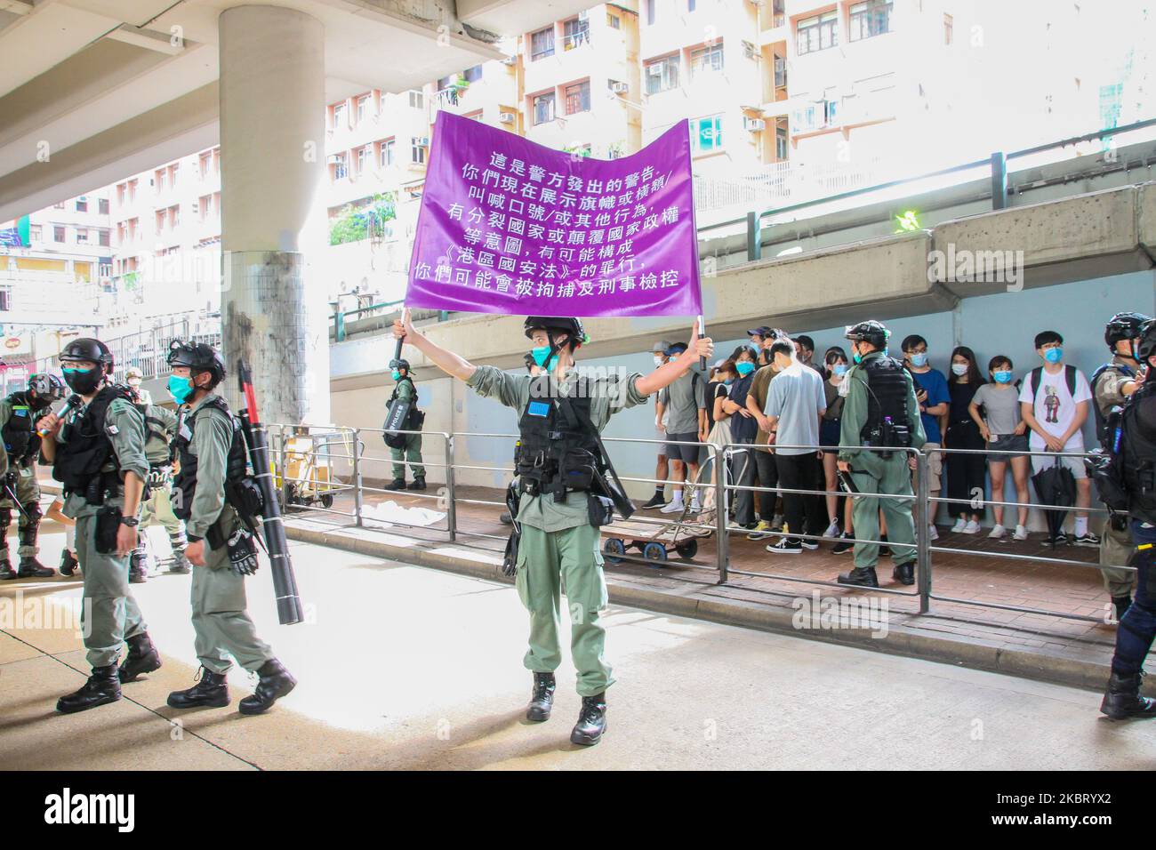 Police raise the new purple flag which warns residents the current ...