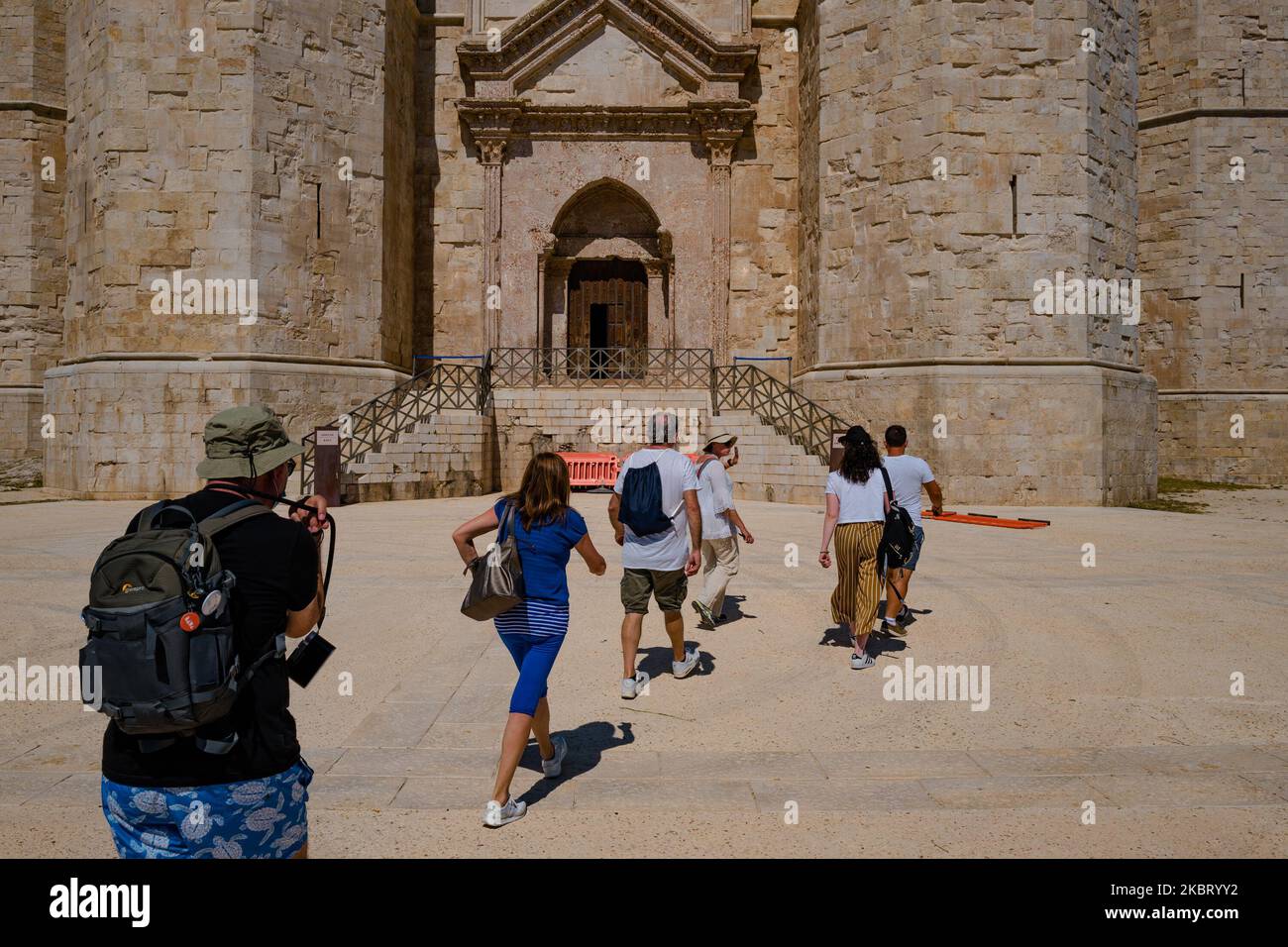 Tourists followed by a tour guide outside the Castel del Monte near ...