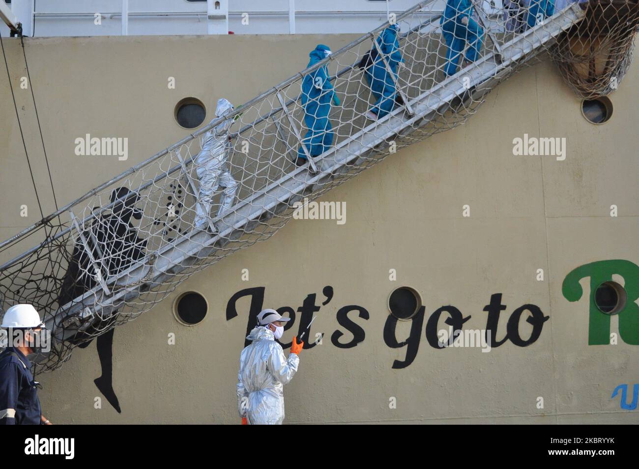A number of medical staff climbed the steps of KM Labobar to welcome ...
